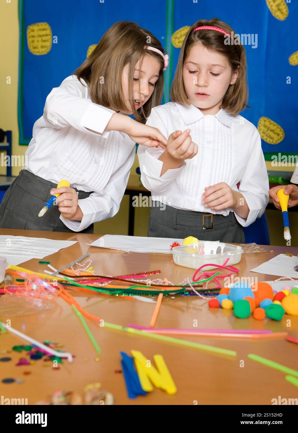 Elementary School: Sibling Rivalry. A pair of young primary school ...