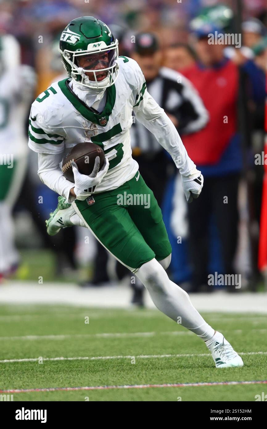 New York Jets wide receiver Garrett Wilson (5) carries the ball during ...