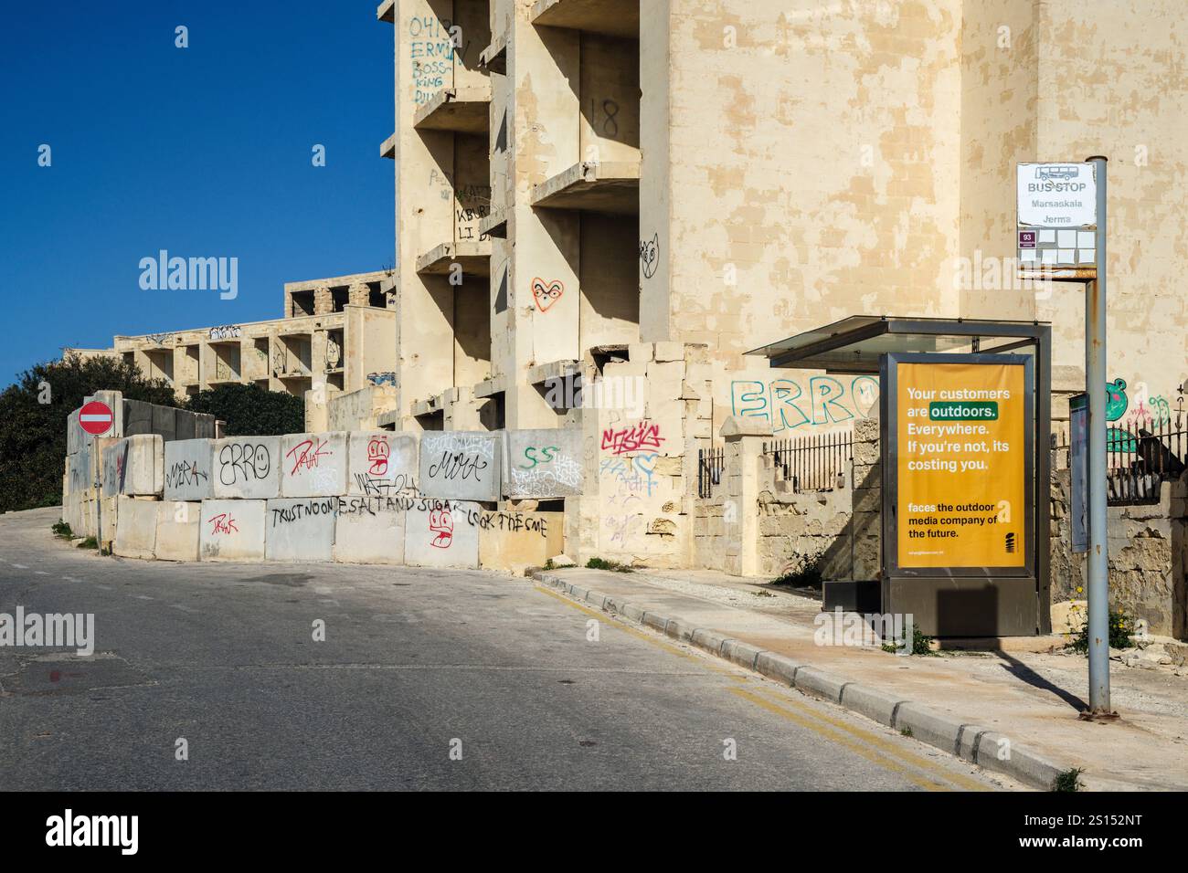 A bus stop by the abandoned Jerma Palace Hotel, Marsaskala, Malta Stock ...