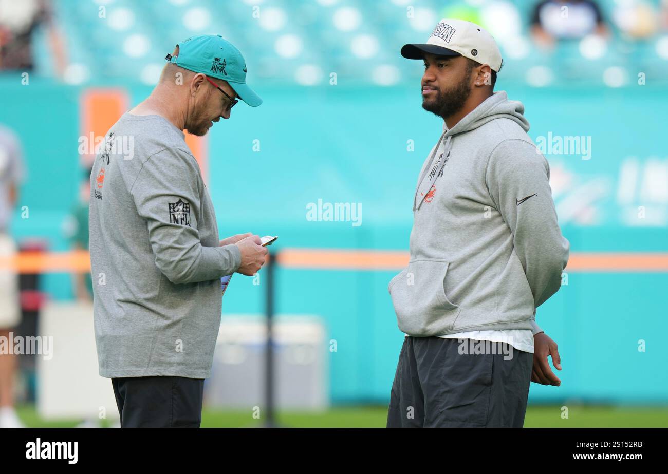 Miami Dolphins quarterback Tua Tagovailoa, right, talks with ...