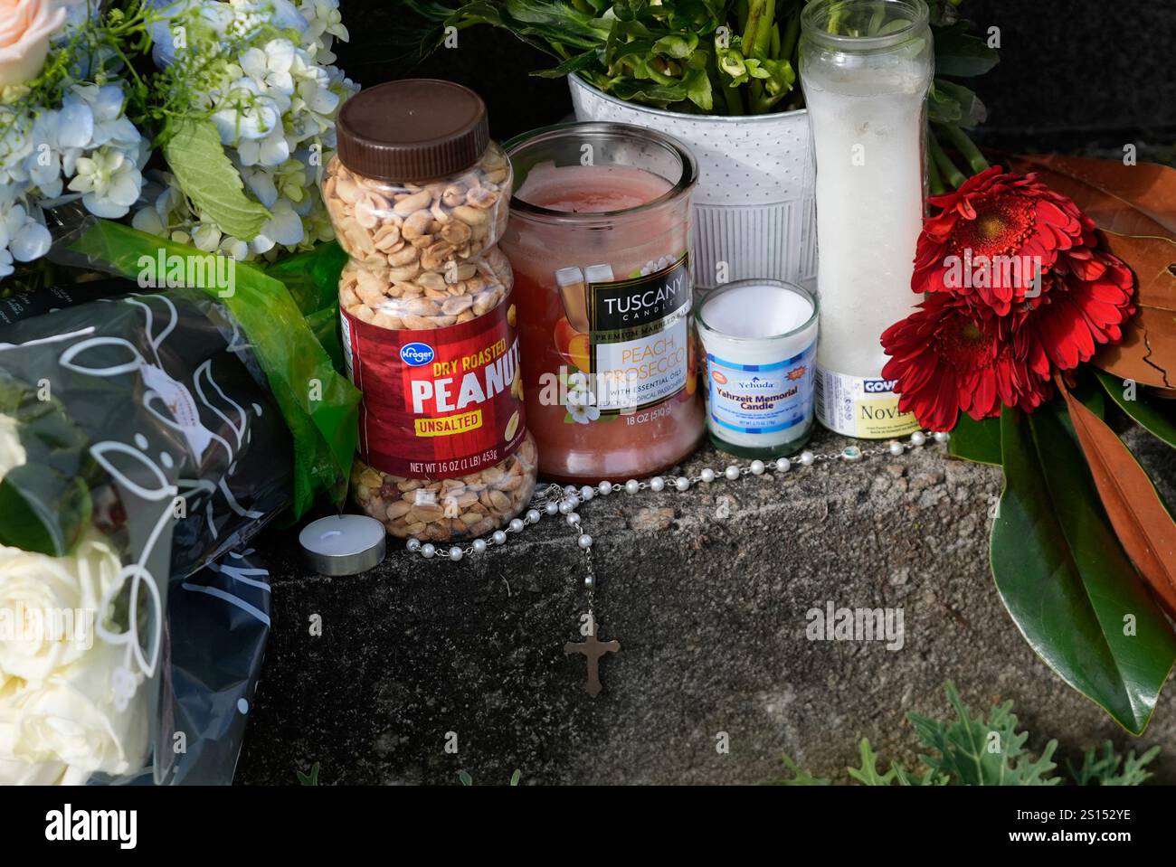 A jar of peanuts is among the items left in tribute to former President ...