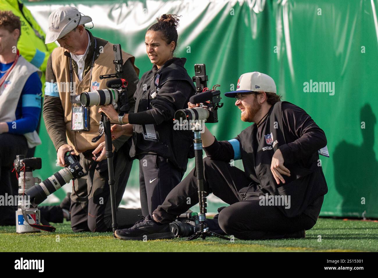 NFL content creator/mentor Denis Kennedy, right, shoots works alongside ...