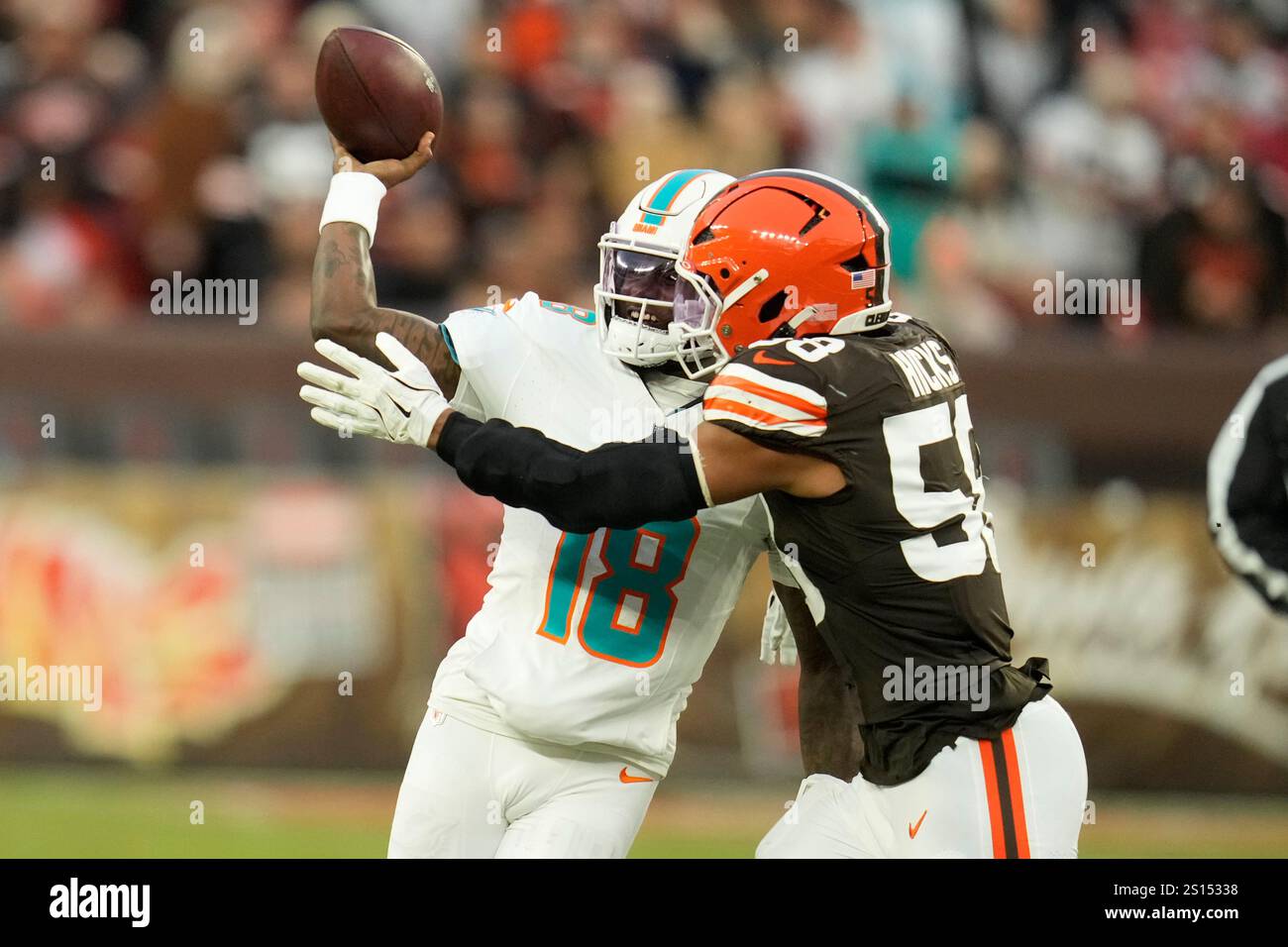 Miami Dolphins quarterback Tyler Huntley (18) passes under pressure ...