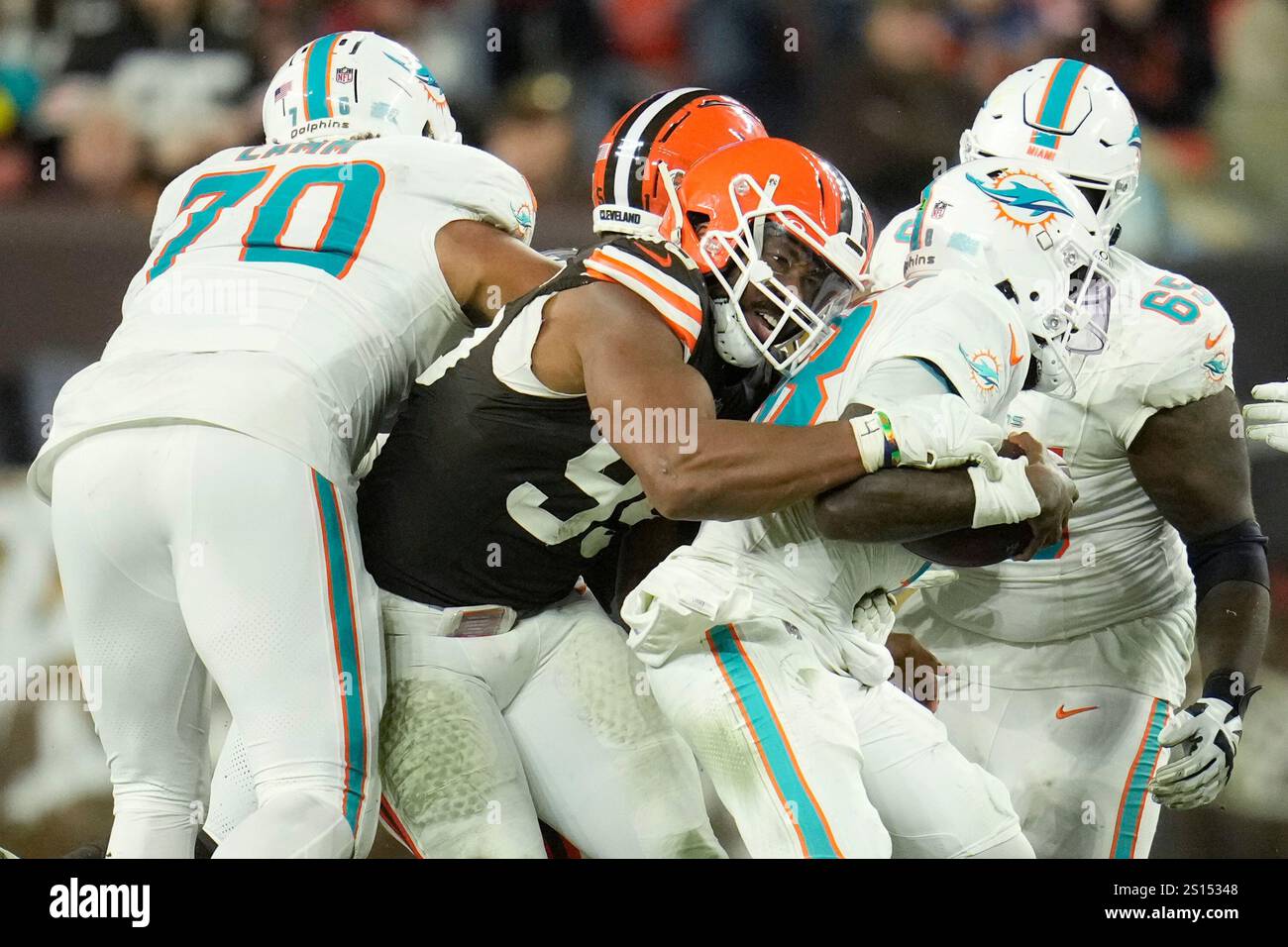 Cleveland Browns defensive end Myles Garrett, left, sacks Miami ...