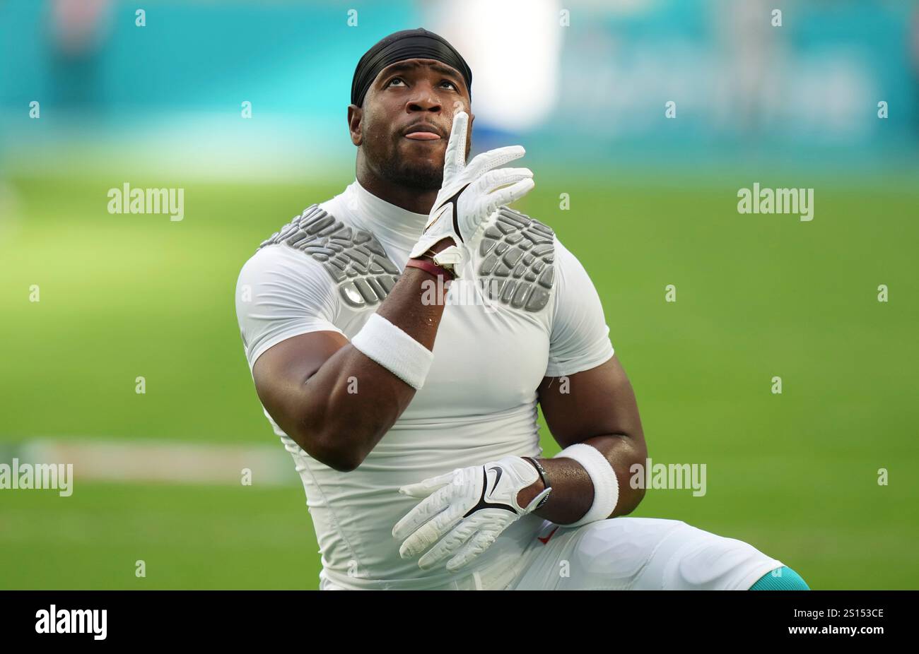 Miami Dolphins tight end Jonnu Smith kneels on the field before an NFL ...