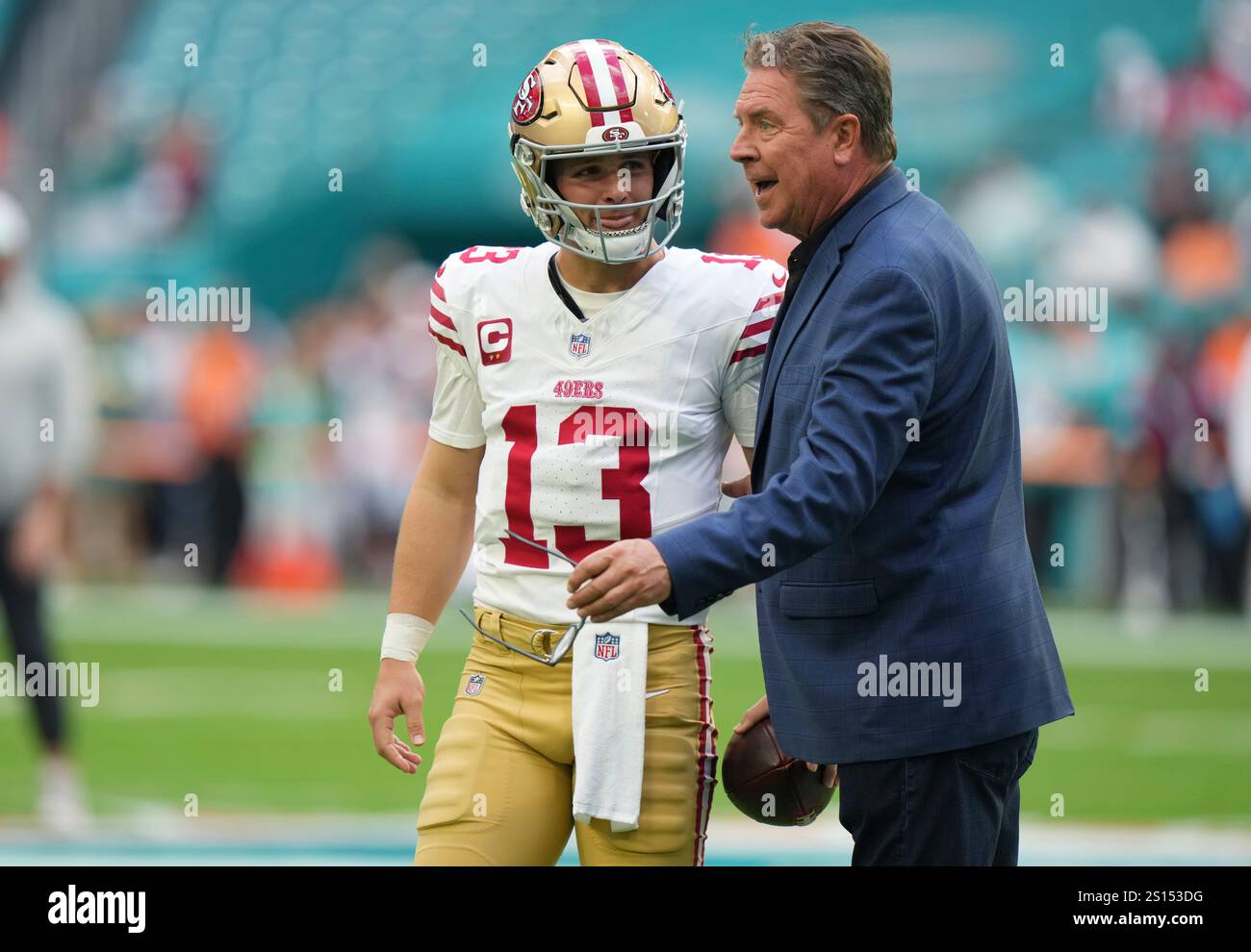 San Francisco 49ers quarterback Brock Purdy (13) talks with former ...