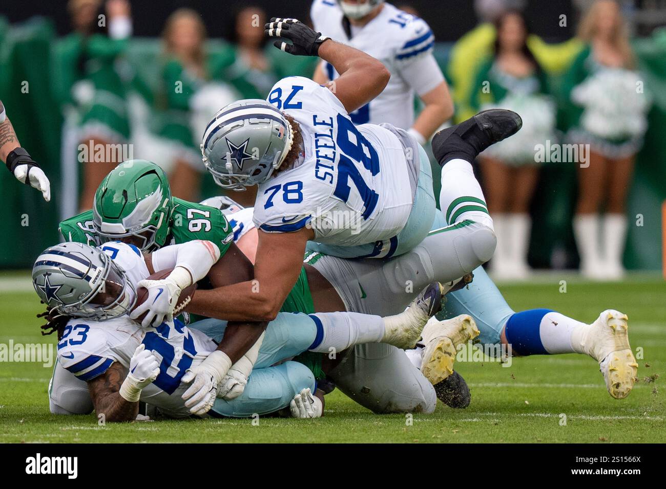 Dallas Cowboys running back Rico Dowdle (23) gets brought down by ...