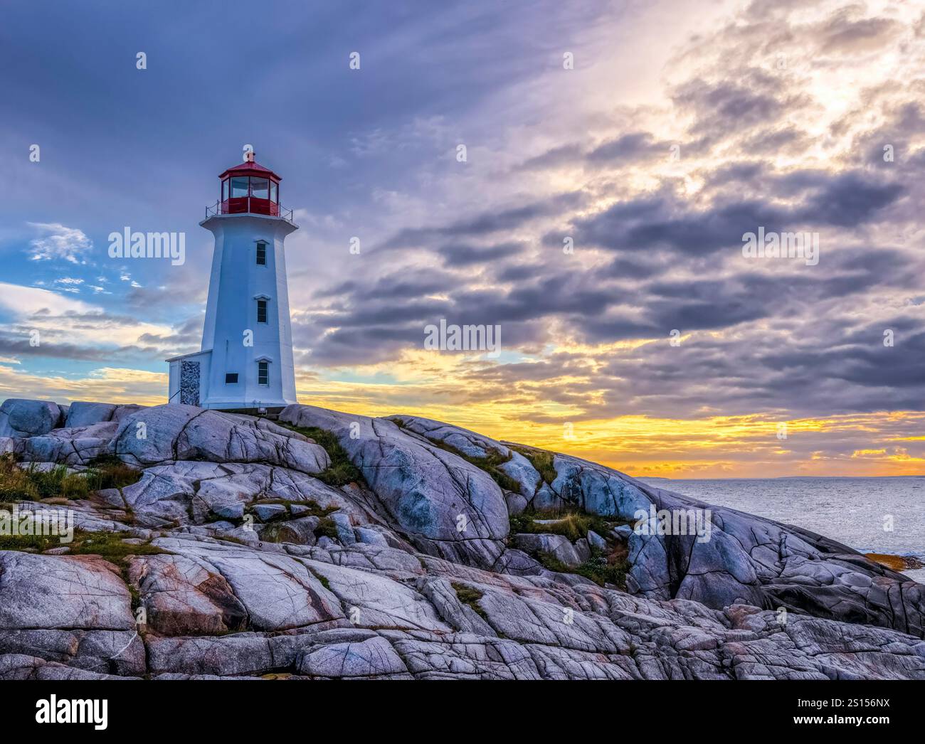 Sunset at Peggys Point Lighthouse also known as Peggys Cove Lighthouse ...