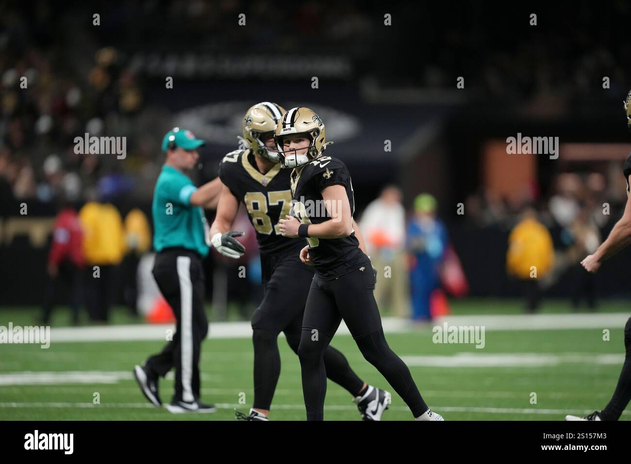 New Orleans Saints place kicker Blake Grupe (19) runs off the field ...