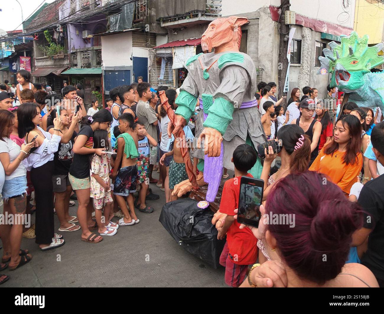Malabon, Philippines. 31st Dec, 2024. People take pictures with their ...