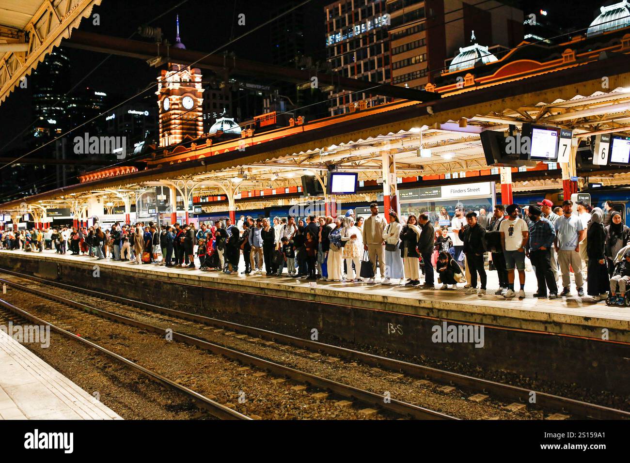 Melbourne, Australia. 31st Dec, 2024. The footpaths are crowded with ...