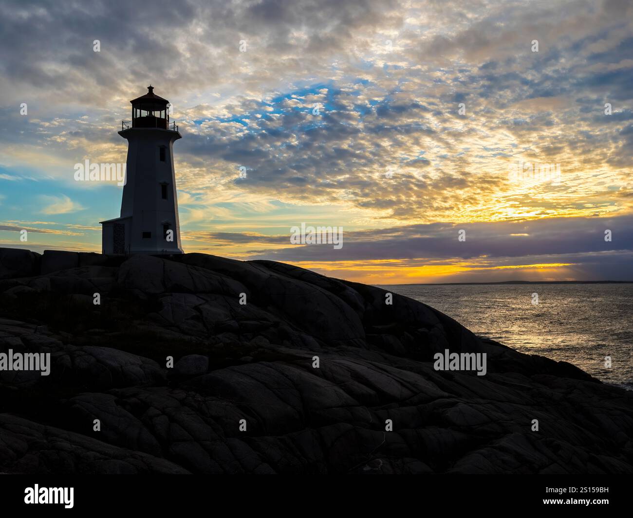 Sunset at Peggys Point Lighthouse also known as Peggys Cove Lighthouse ...