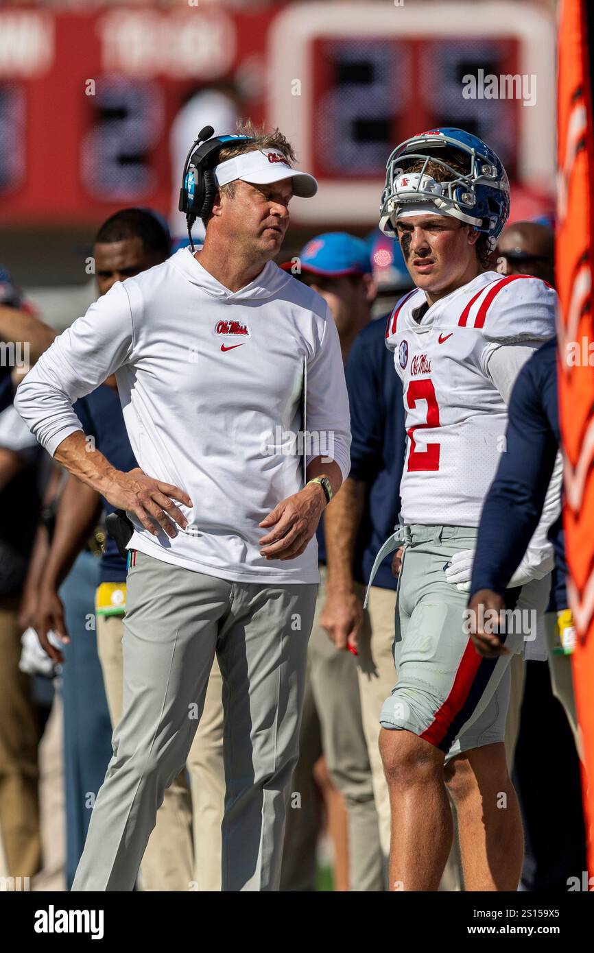 Mississippi head coach Lane Kiffin, left, talks with Mississippi ...