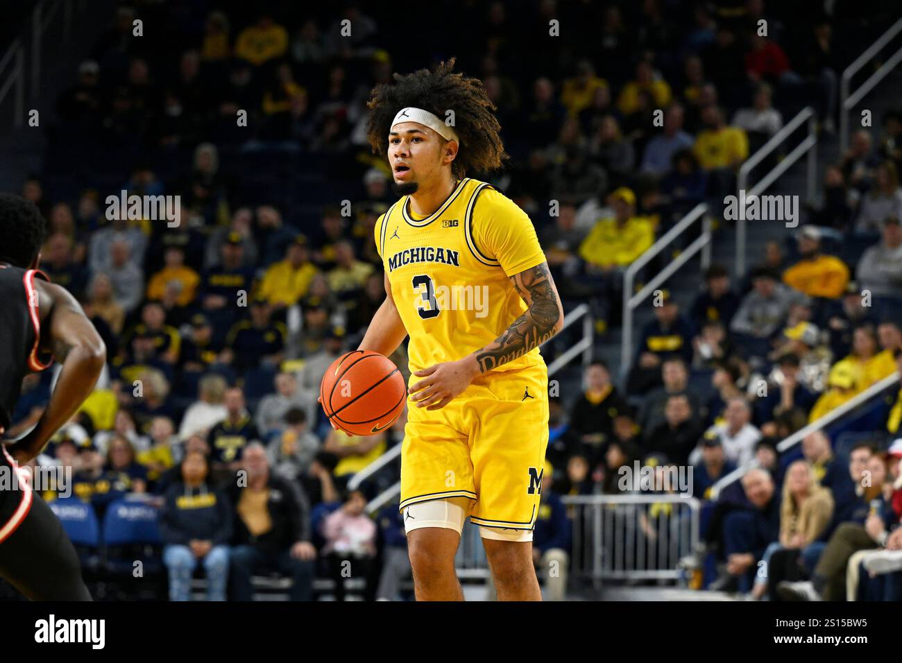 Michigan guard Tre Donaldson dribbles during the second half of an NCAA ...