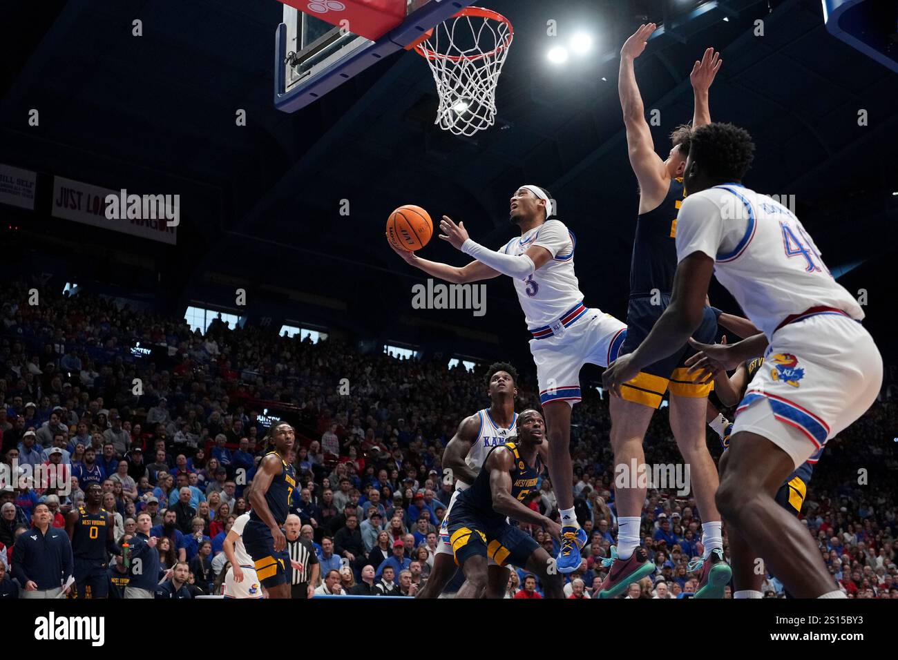 Kansas guard Dajuan Harris Jr. (3) puts up a shot during the first half ...