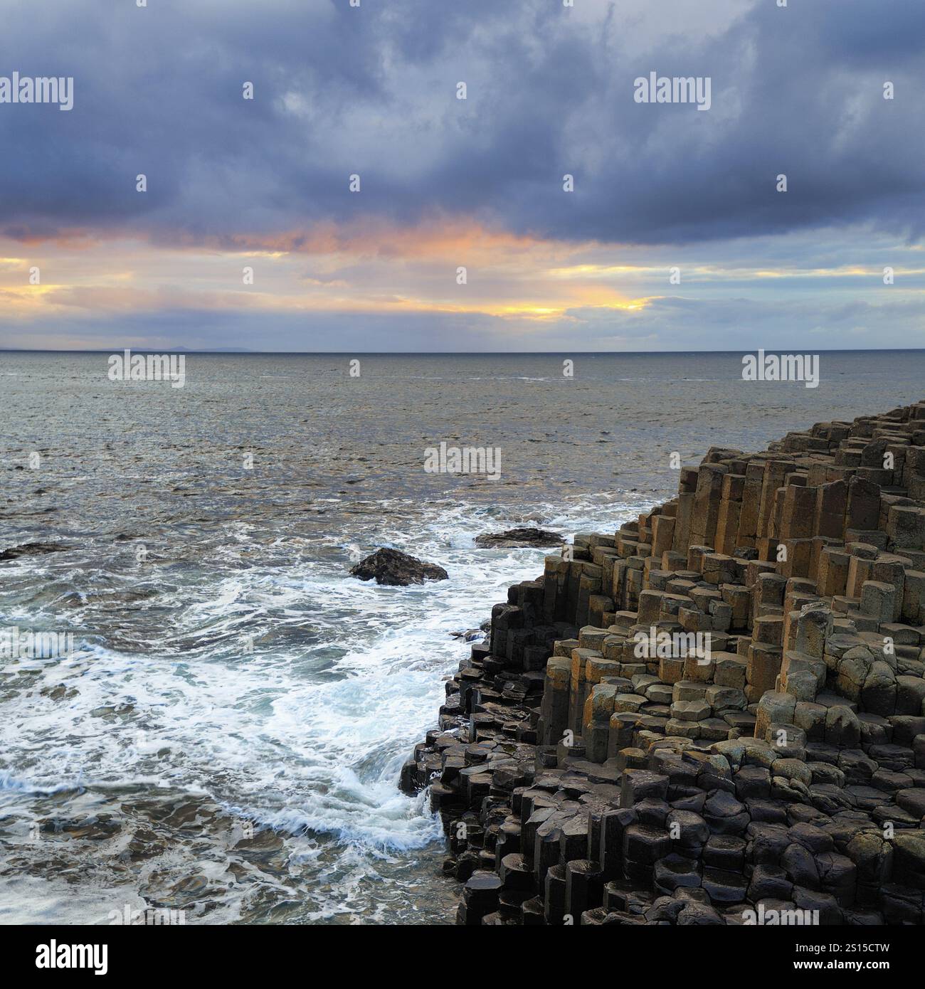 Rocky coast with basalt columns, coastline, dusk by the sea, Giant's ...