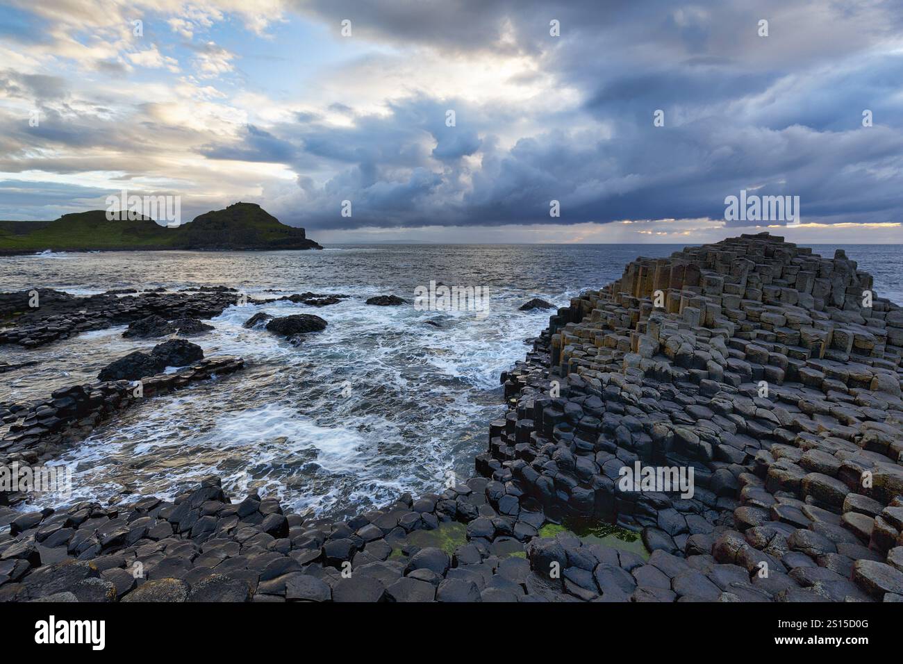 Rocky coast with basalt columns, coastline, dusk by the sea, Giant's ...