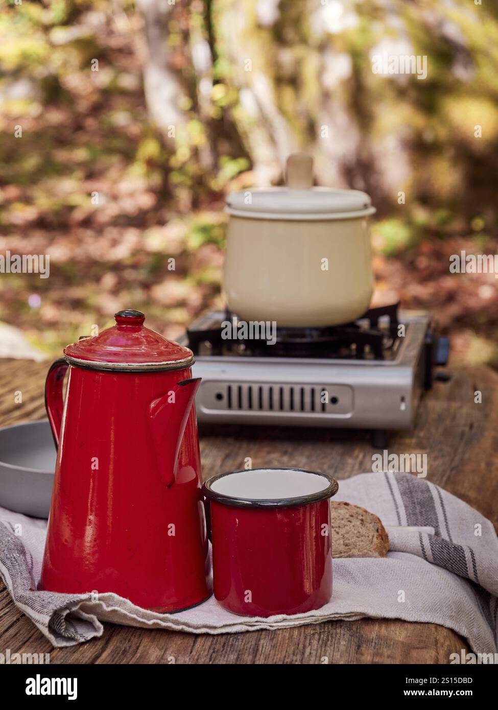 Cook food and drink outdoors. Coffee in the forest. Vintage red coffee ...