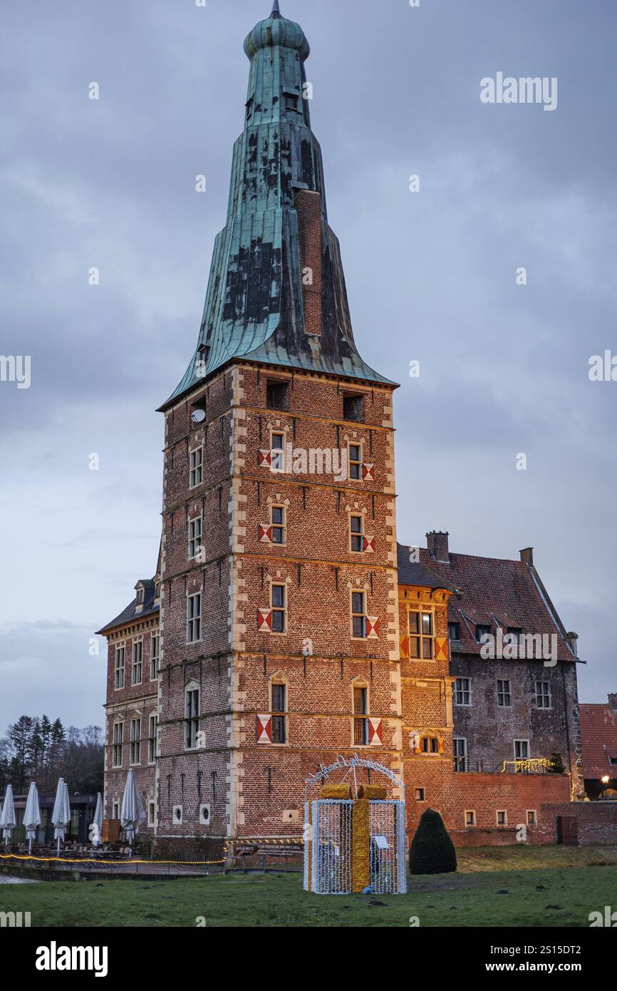 High, illuminated castle tower in historic brick architecture, Rasfeld ...