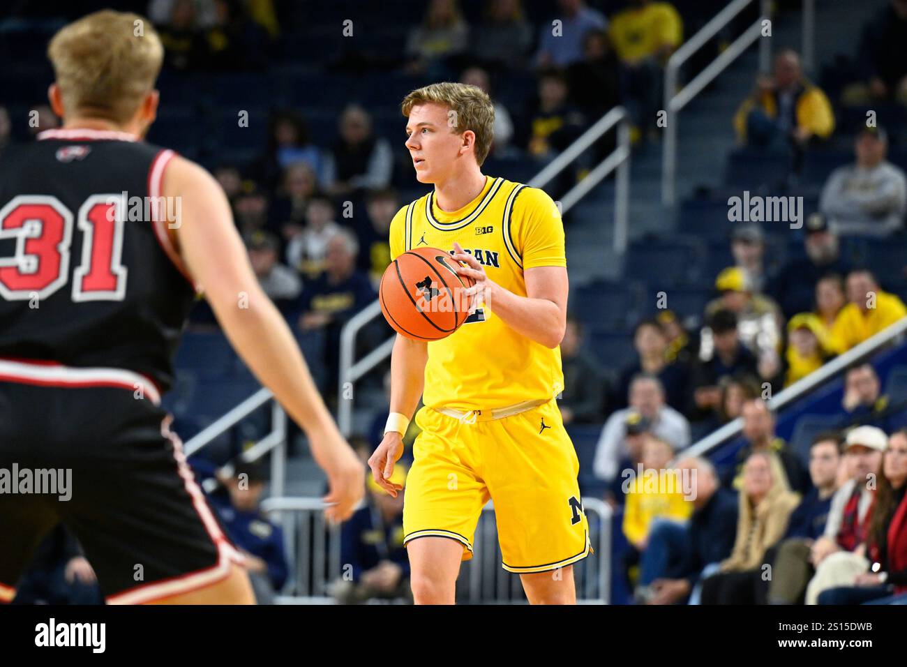 Michigan guard Charlie May (12) dribbles during the second half of an ...