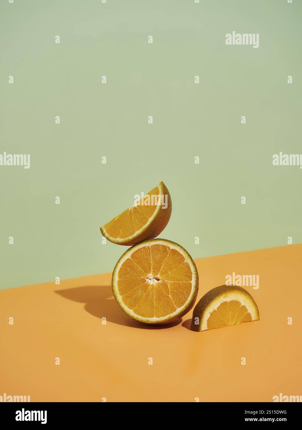 Half orange, slice and segment in modern composition. Elements placed ...