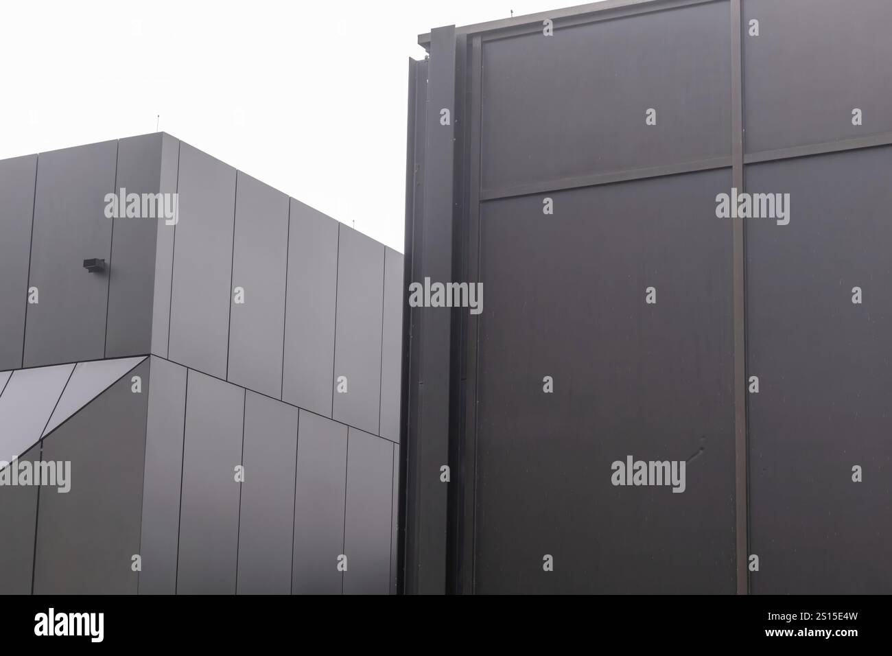 Architectural detail featuring contrasting gray and dark panels on a ...