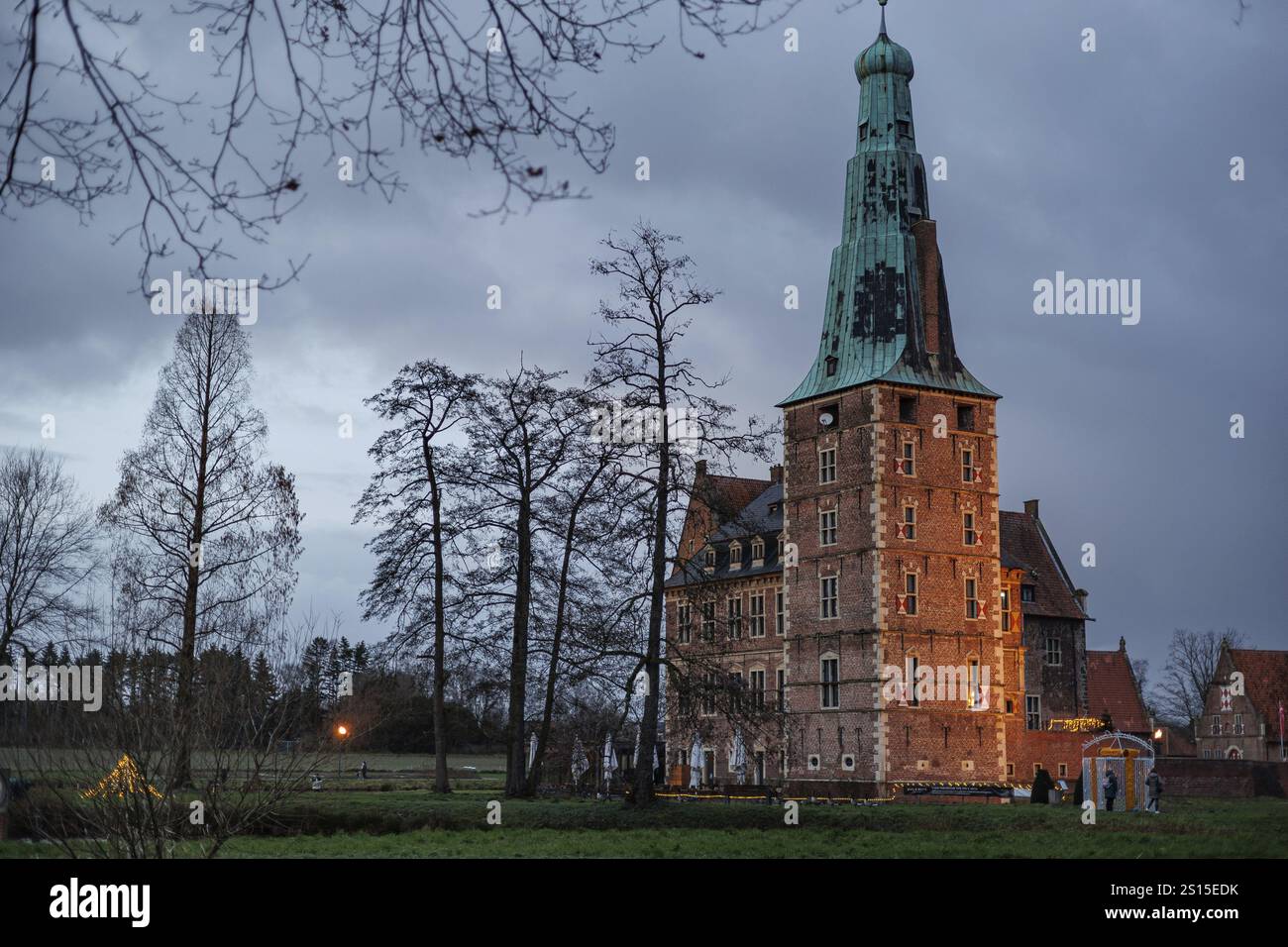 Old castle in an evening mood with illuminated details and barren ...
