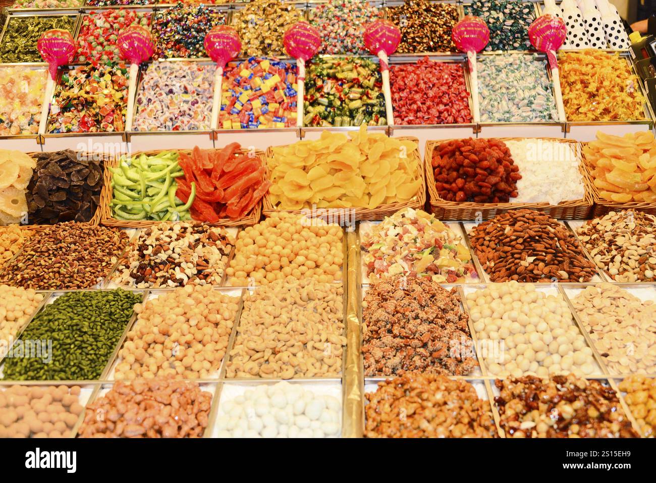 Colourful selection of dry snacks and sweets in orderly compartments at ...