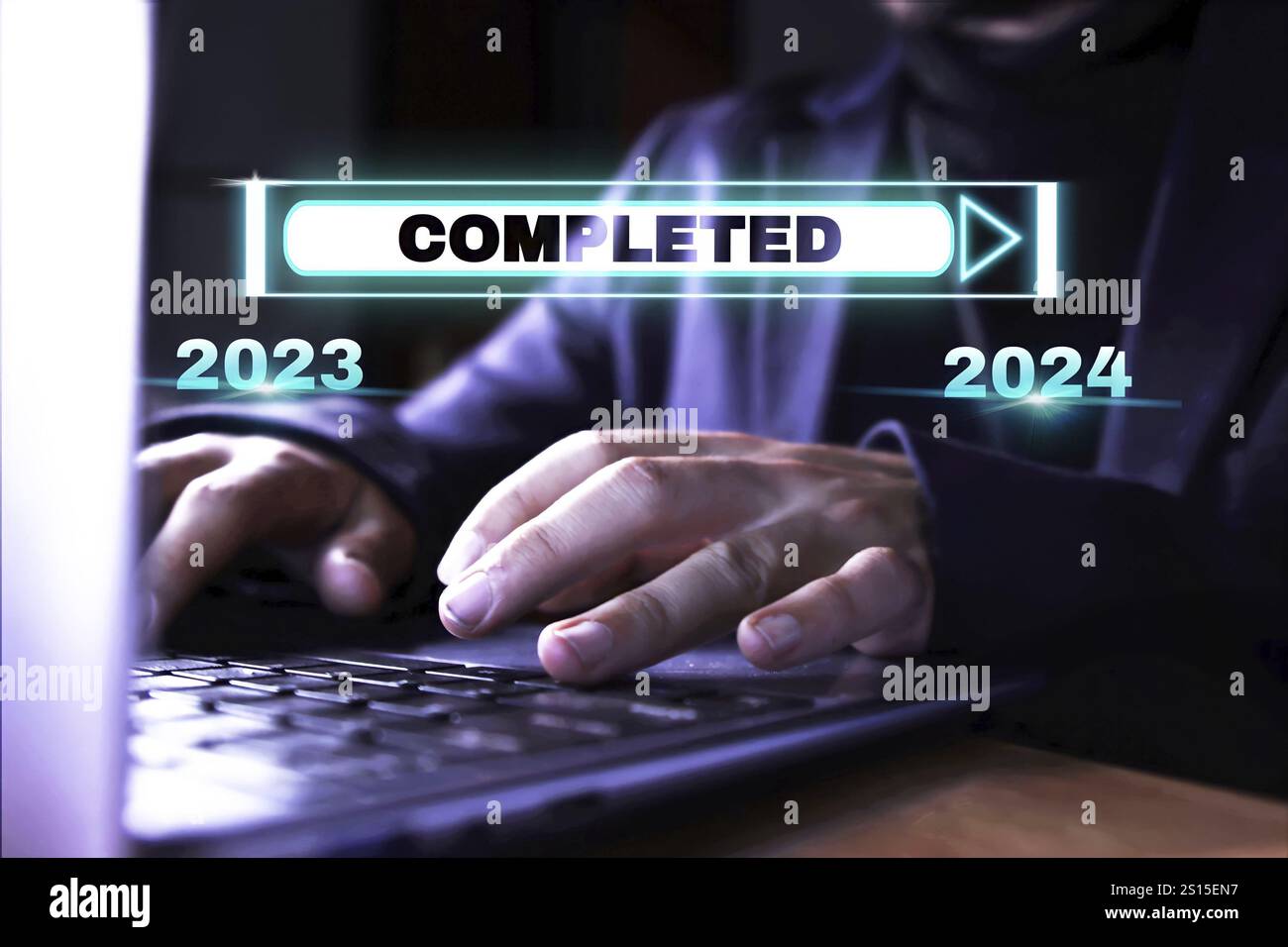Businessman's hands using the computer with a digital chart of the year ...