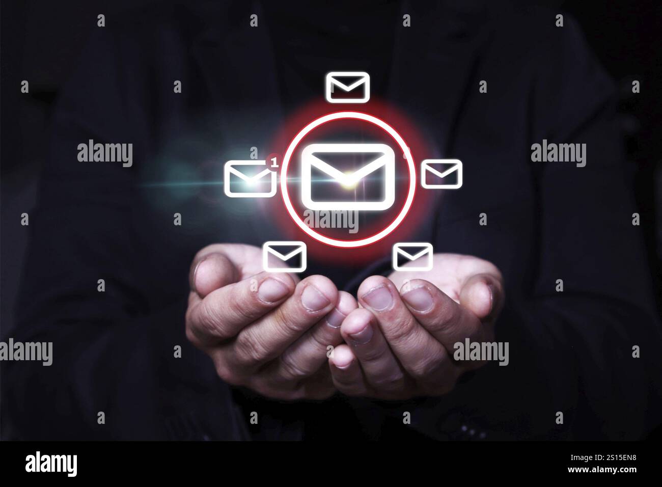 Person holding a virtual email notification symbol, representing ...