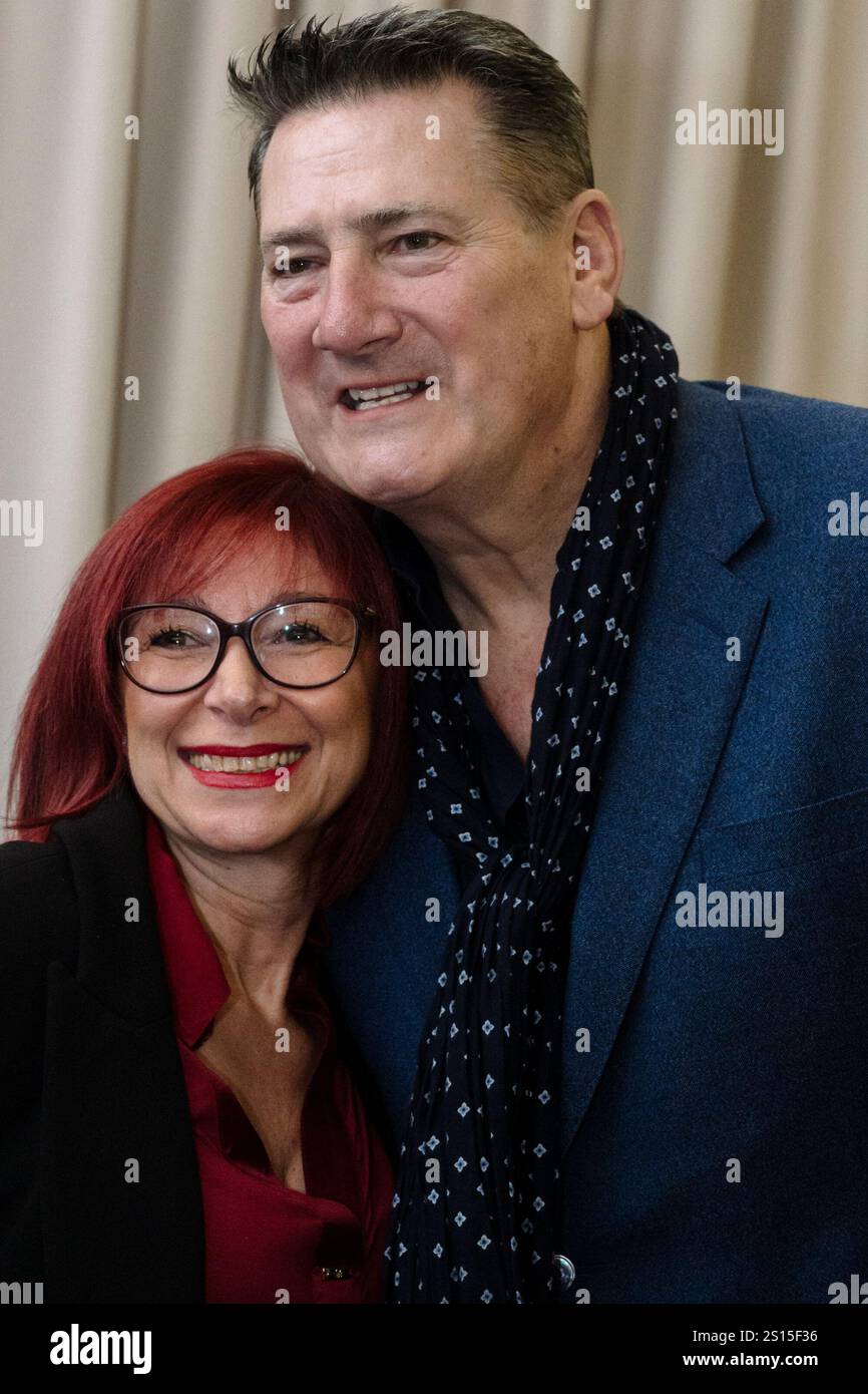 Trani, Italy. 31st Dec, 2024. Tony Hadley (R) seen with a fan. A ...