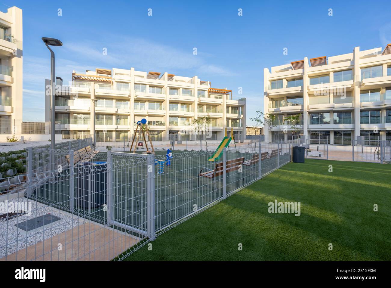 Family-friendly residential complex featuring a secure playground, lush ...