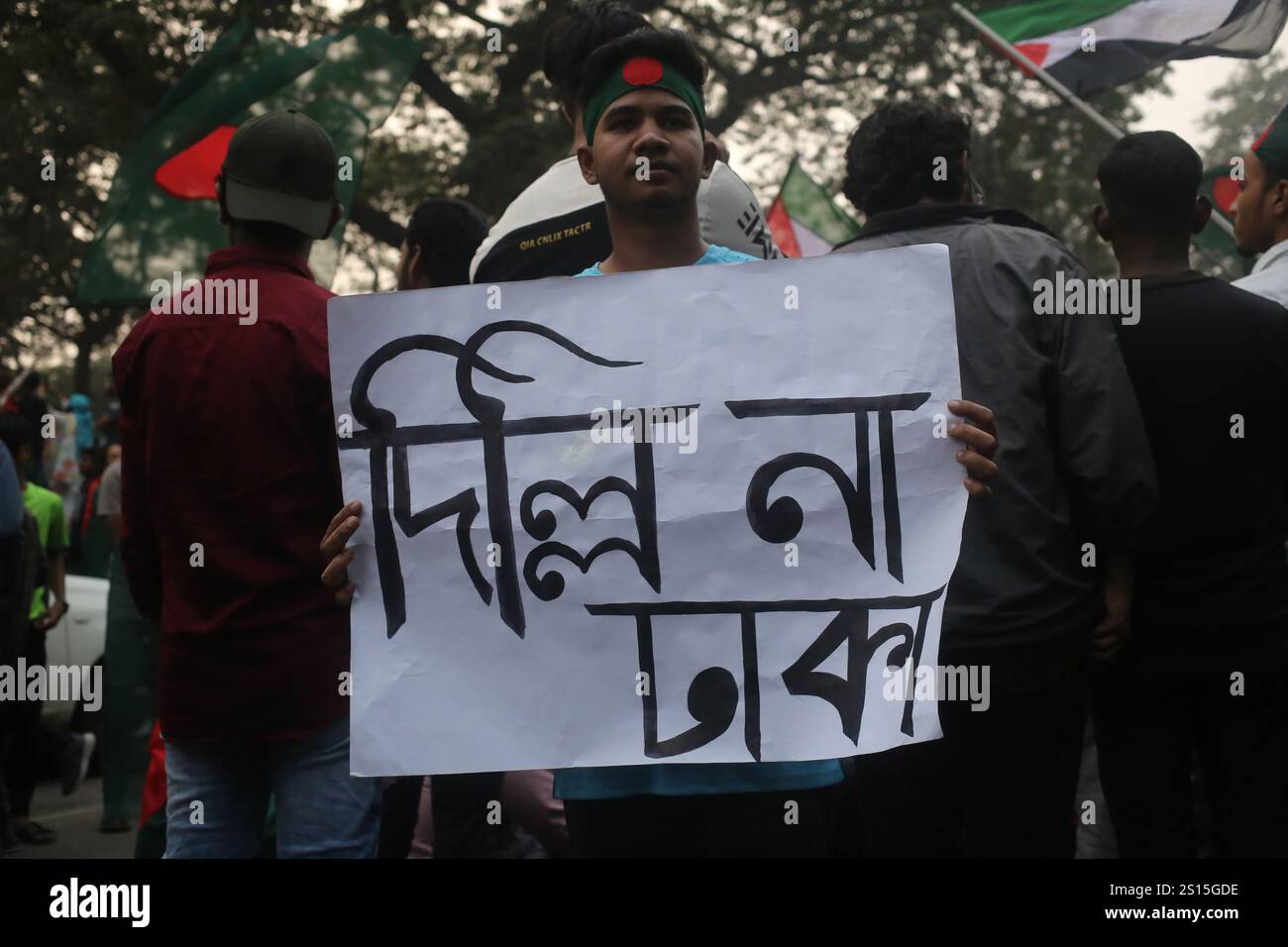 Dhaka, Bangladesh. 1st Jan, 2025. A student holding a placard that says ''Delhi or Dhaka ...