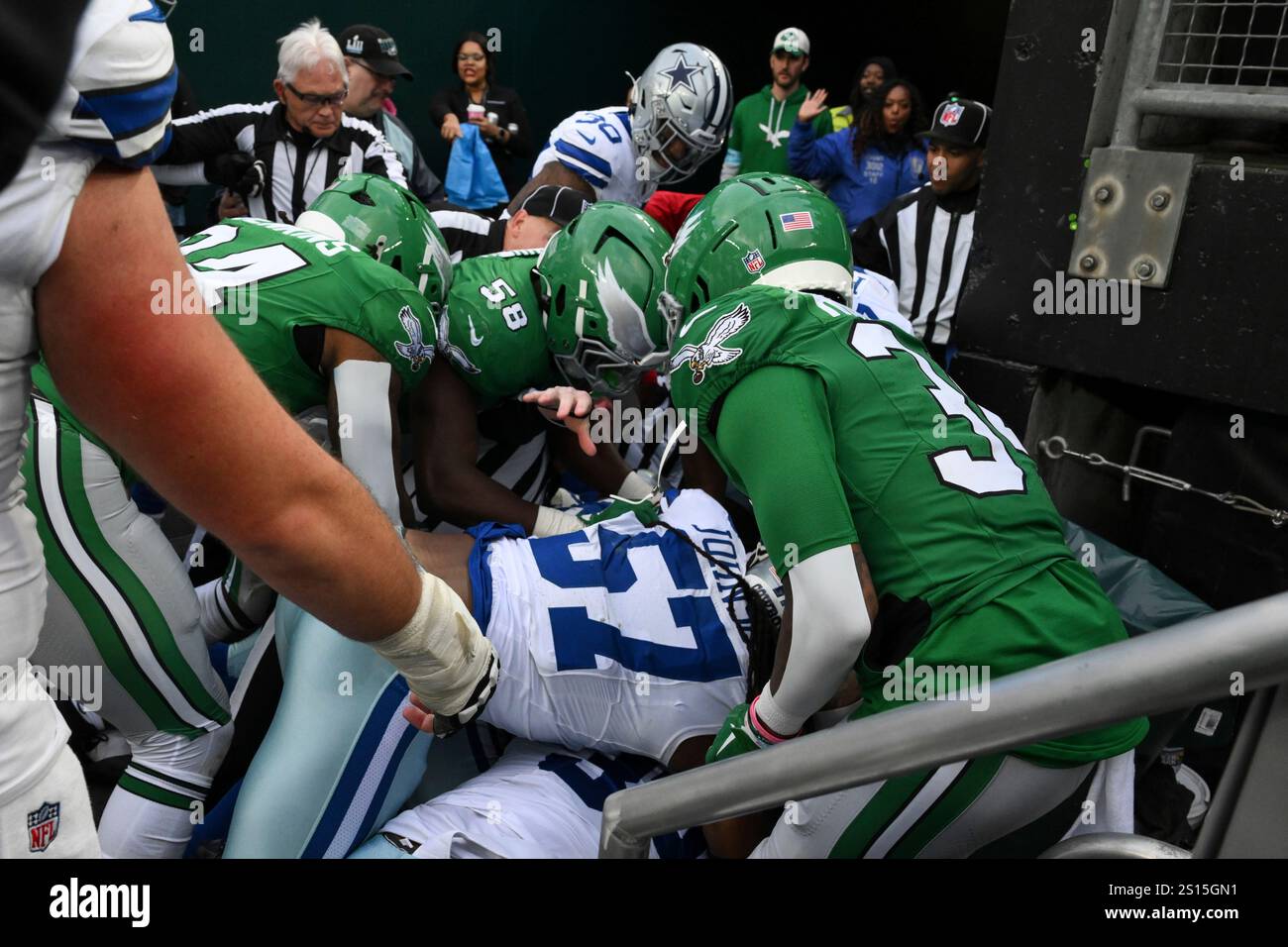 Philadelphia Eagles and Dallas Cowboys players fight on the sideline ...