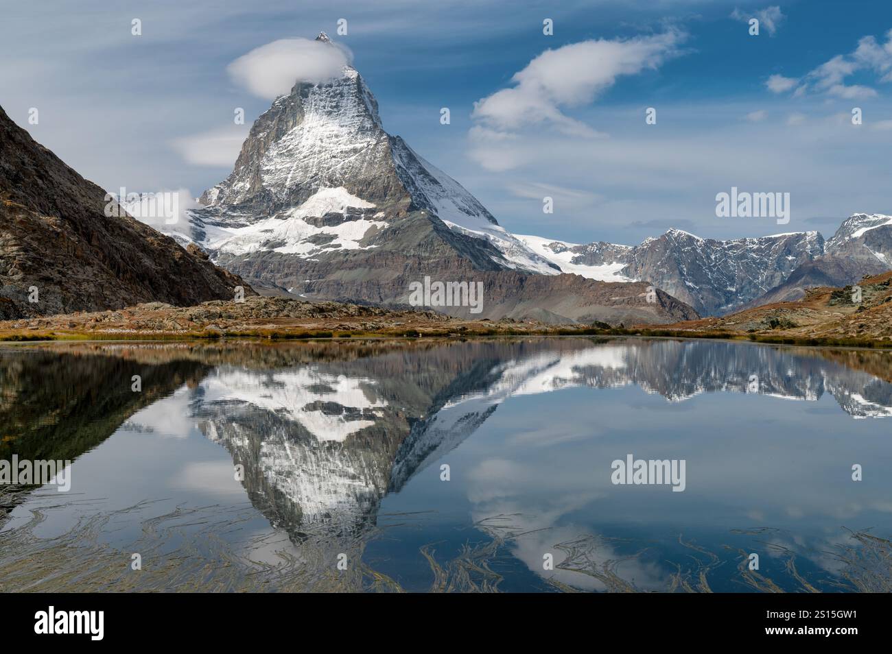 Apls scenery with the Matterhorn Mountain and its reflection in a lake ...