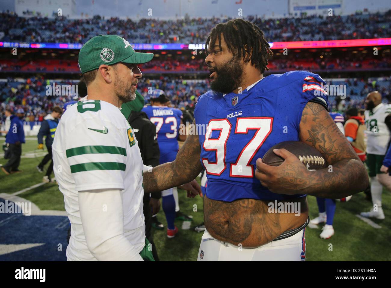 New York Jets quarterback Aaron Rodgers (8) and Buffalo Bills defensive ...