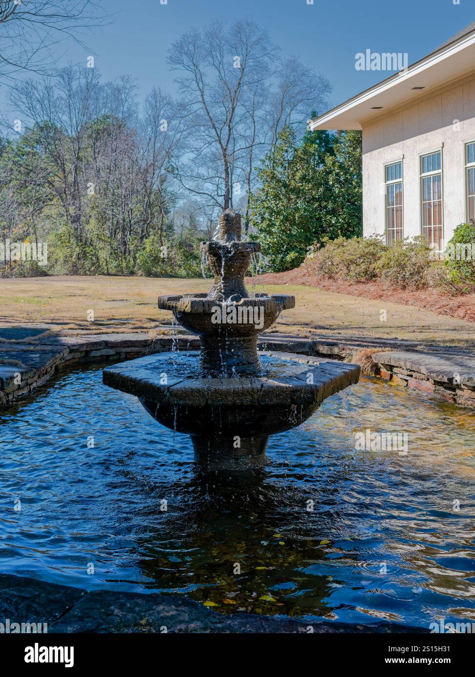 Decorative concrete and stone three tier water fountain in business ...