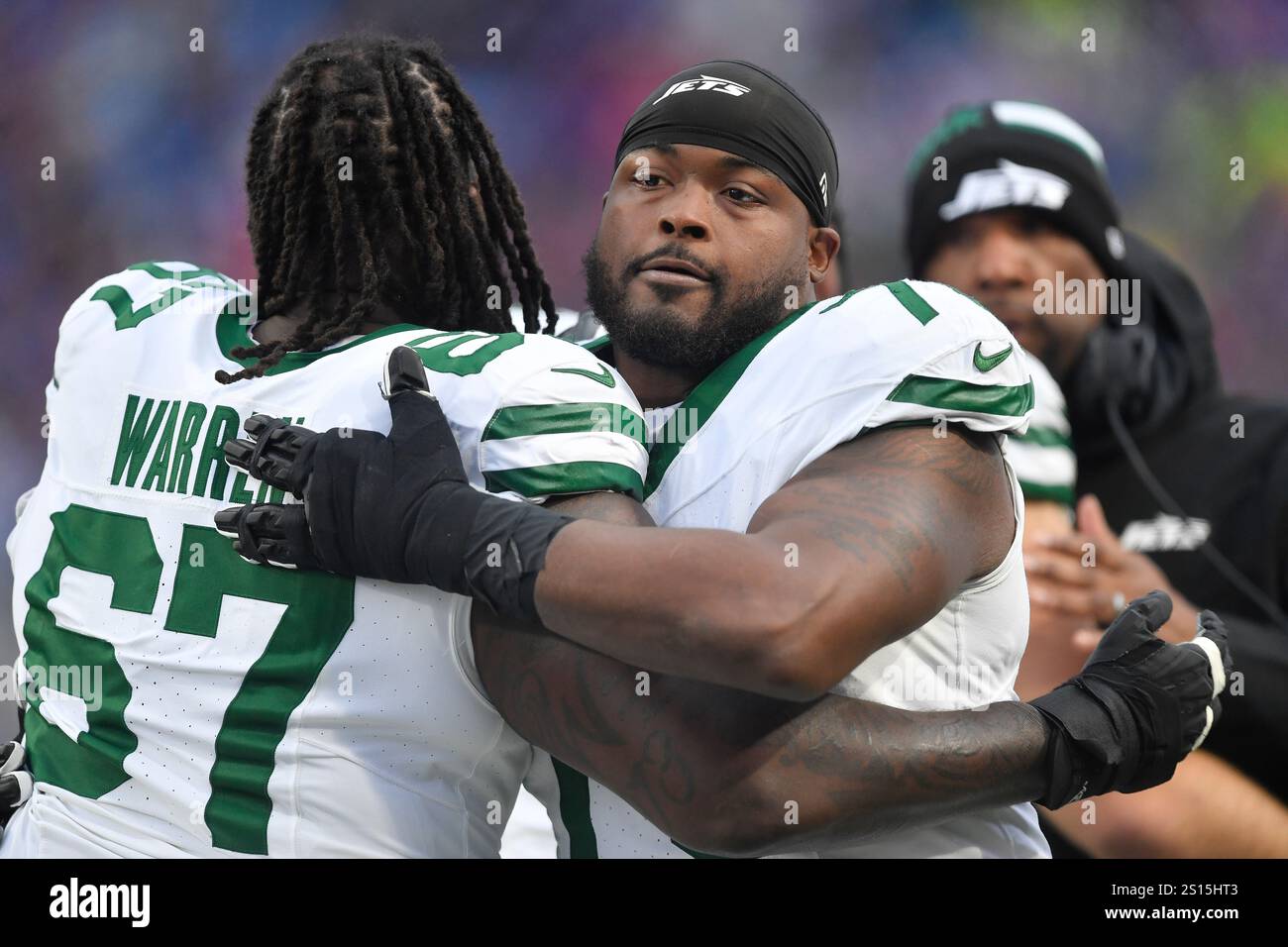 New York Jets offensive lineman John Simpson, right, hugs tackle Carter ...