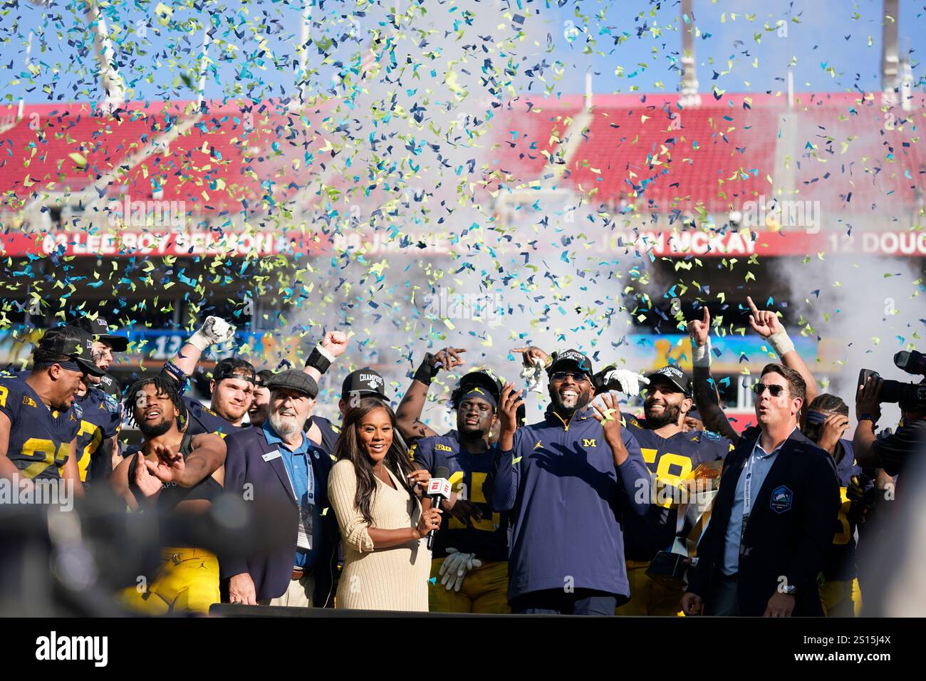 TAMPA, FL - DECEMBER 31: Michigan Wolverines celebrate at the trophy ...