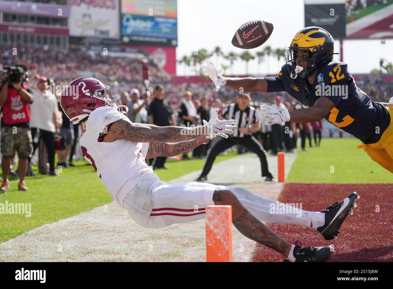 TAMPA, FL - DECEMBER 31: Michigan Wolverines defensive back Aamir Hall (12) deflects a pass ...
