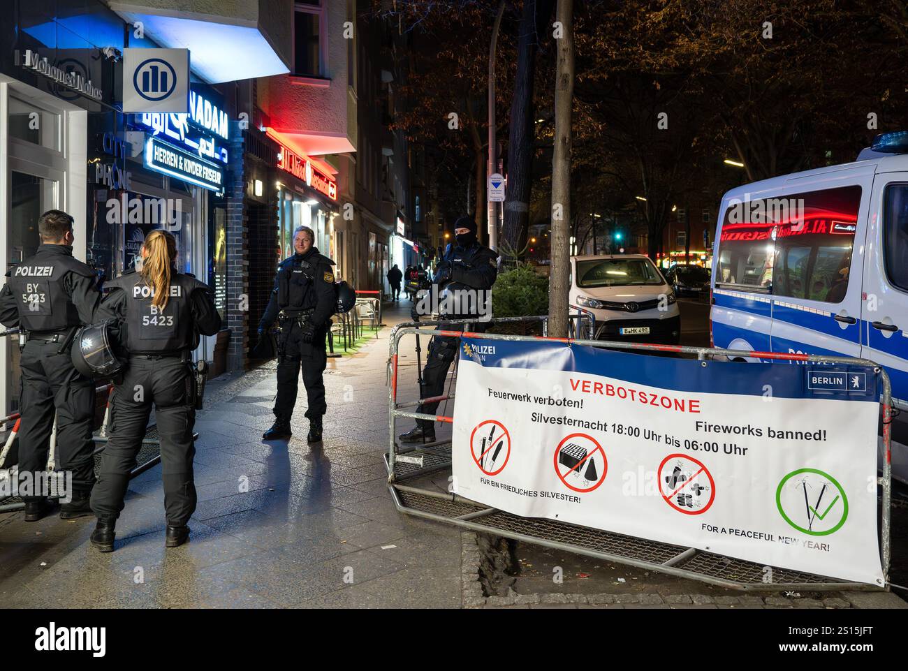 Berlin, Germany. 31st Dec, 2024. Police officers check passers-by on ...