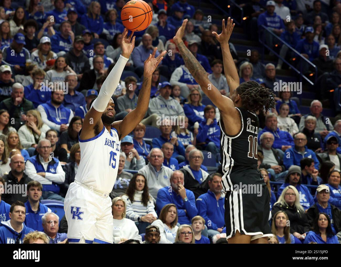 Kentucky's Ansley Almonor, left, shoots while pressured by Brown's Kino ...
