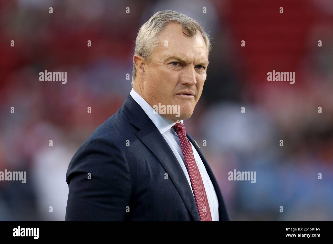 San Francisco 49ers general manager John Lynch walks onto the field ...