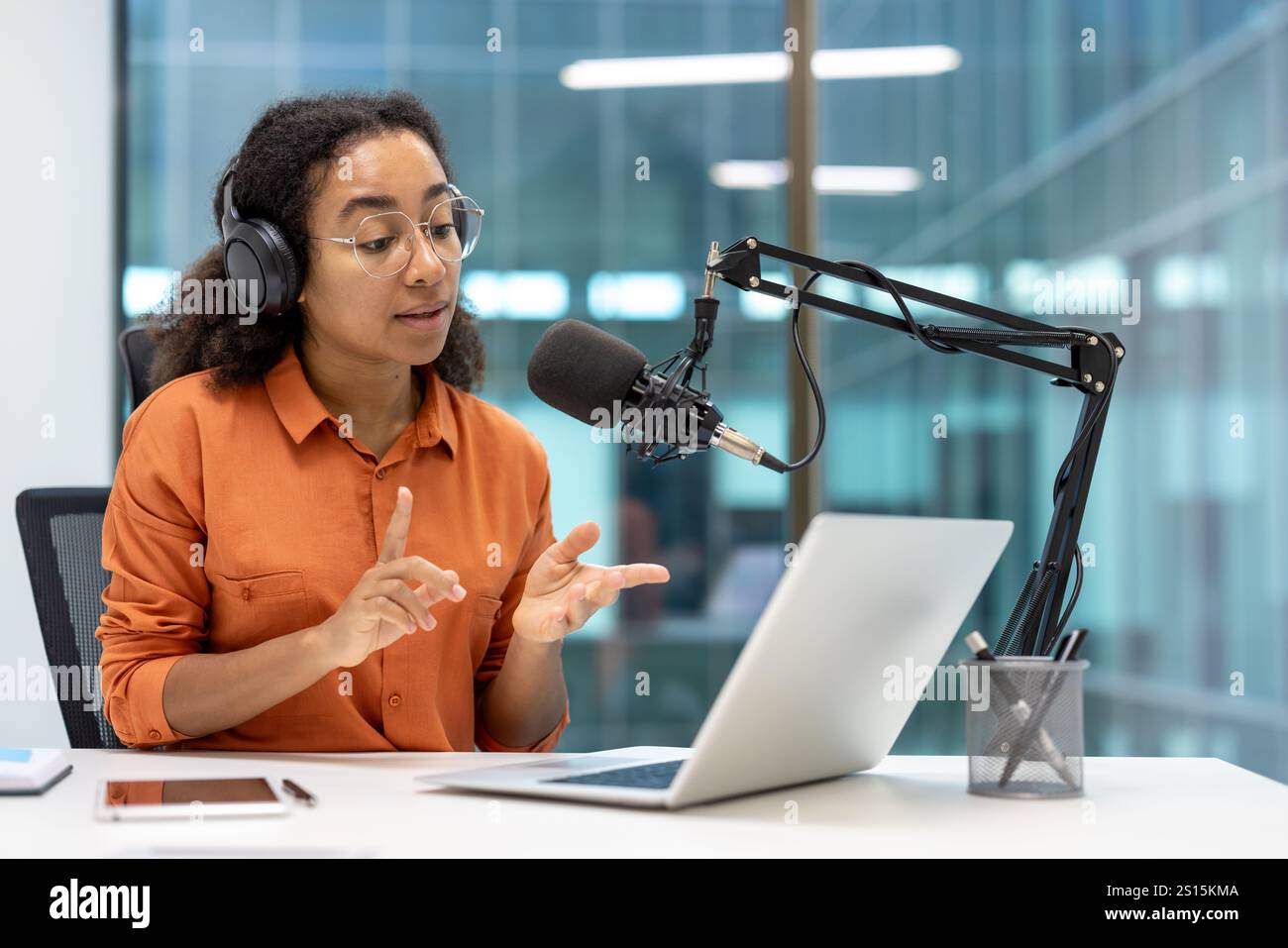 Serious hispanic woman recording hi-res stock photography and images ...