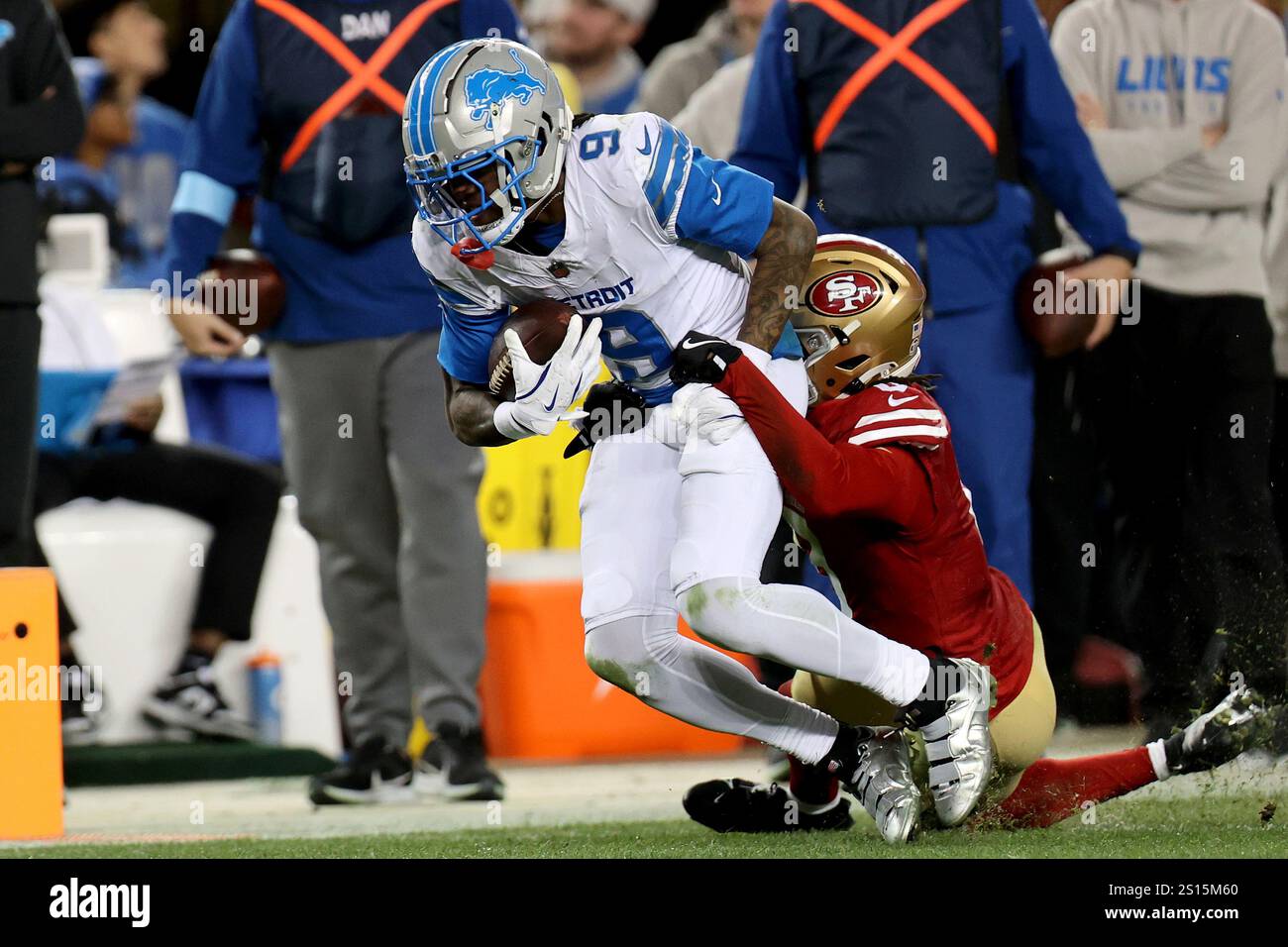 Detroit Lions wide receiver Jameson Williams (9) is tackled by San Francisco 49ers cornerback ...