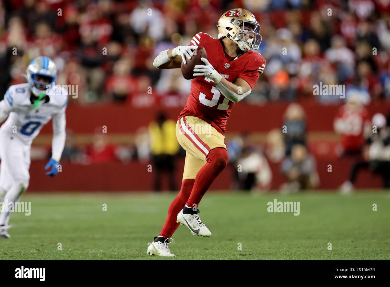 San Francisco 49ers running back Isaac Guerendo (31) runs during an NFL football game against ...