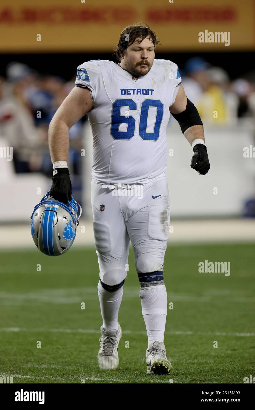 Detroit Lions guard Graham Glasgow (60) walks off the field after an ...
