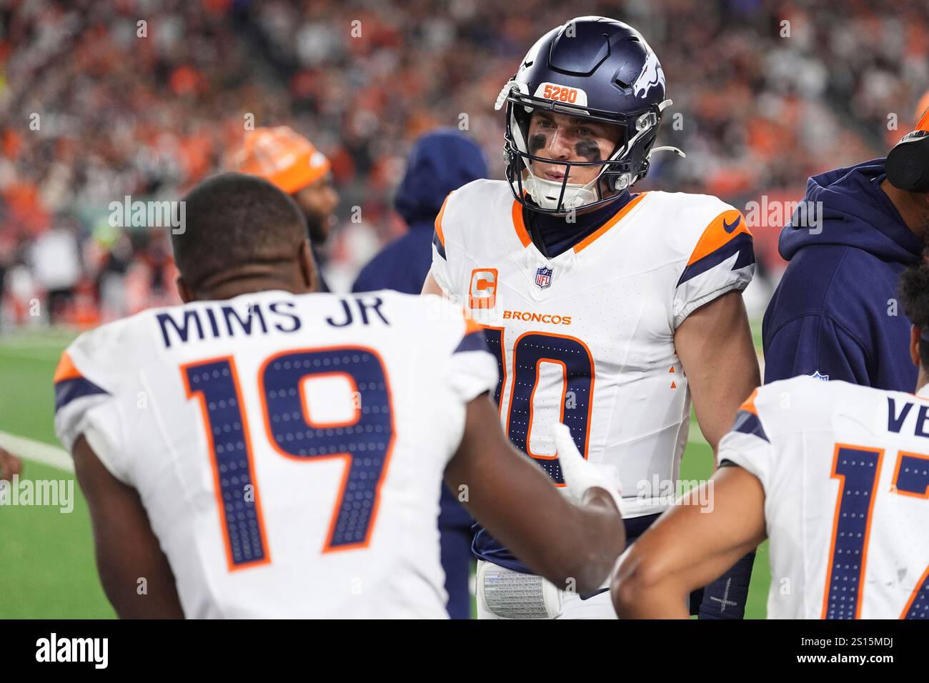 Denver Broncos quarterback Bo Nix talks with Denver Broncos wide receiver Marvin Mims Jr. on the ...