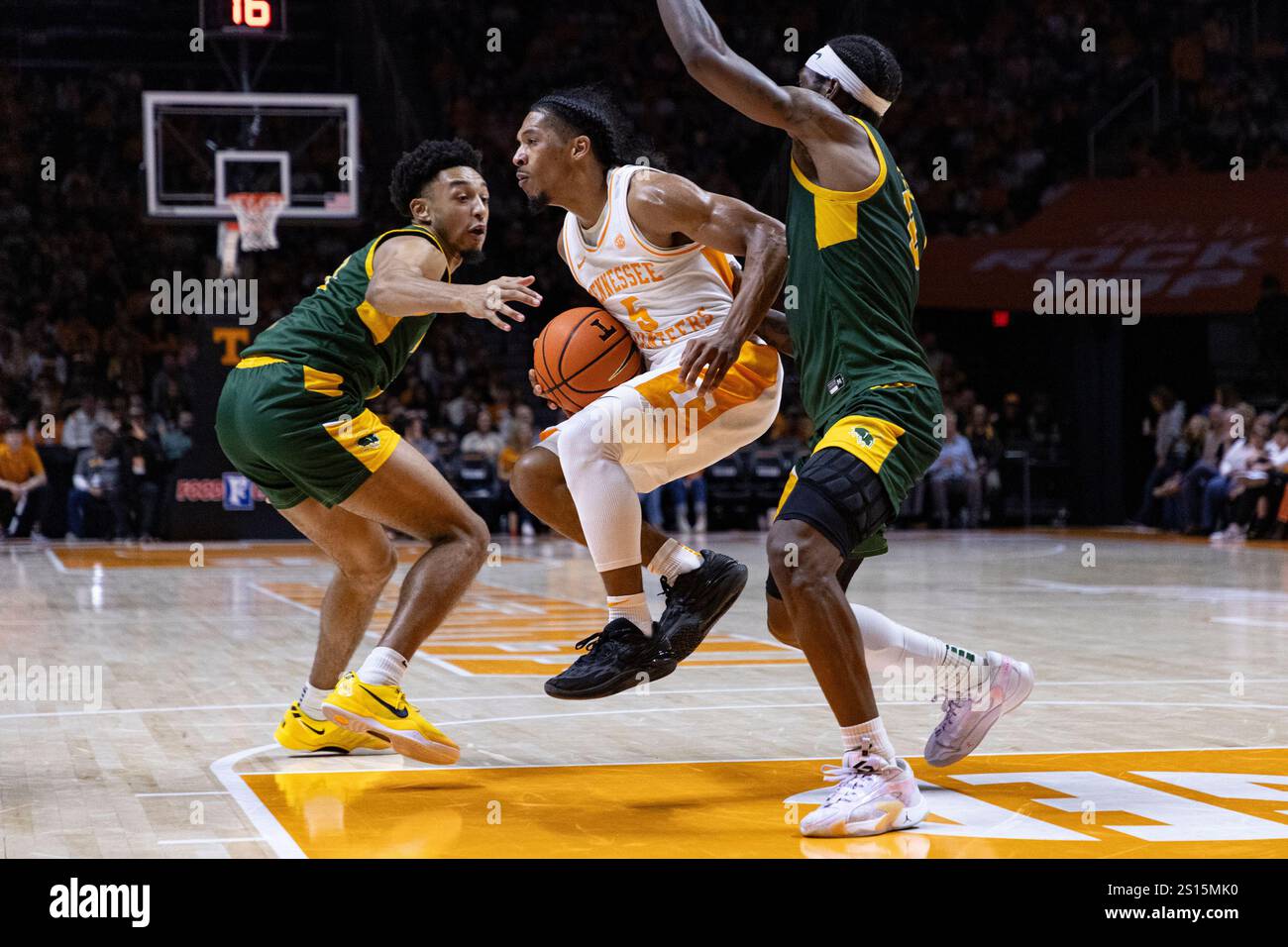 Tennessee guard Zakai Zeigler (5) drives between Norfolk State guards ...