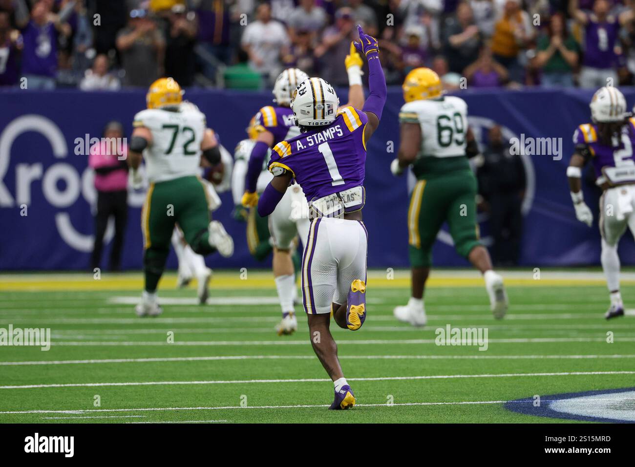 HOUSTON, TX - DECEMBER 31: LSU Tigers cornerback Ashton Stamps (1) holds up the number one sign ...